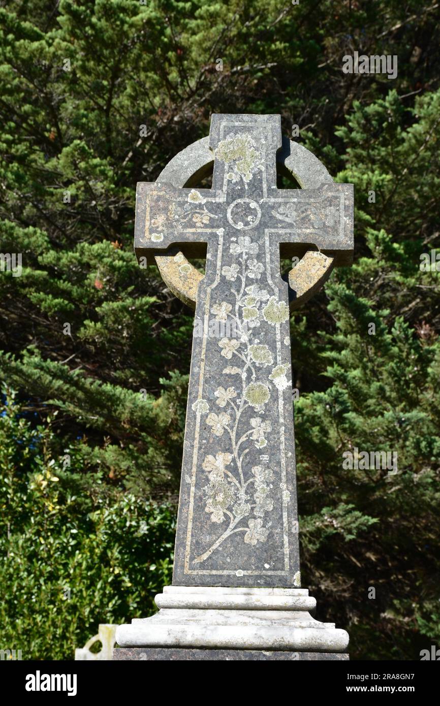 Grey tombstone with floral design Stock Photo - Alamy