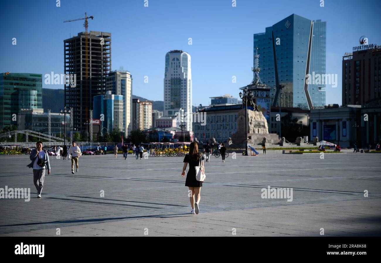 Ulan Bator, Mongolia. 29th June, 2023. Passers-by walk across Sushbaatar Square in front of the ...