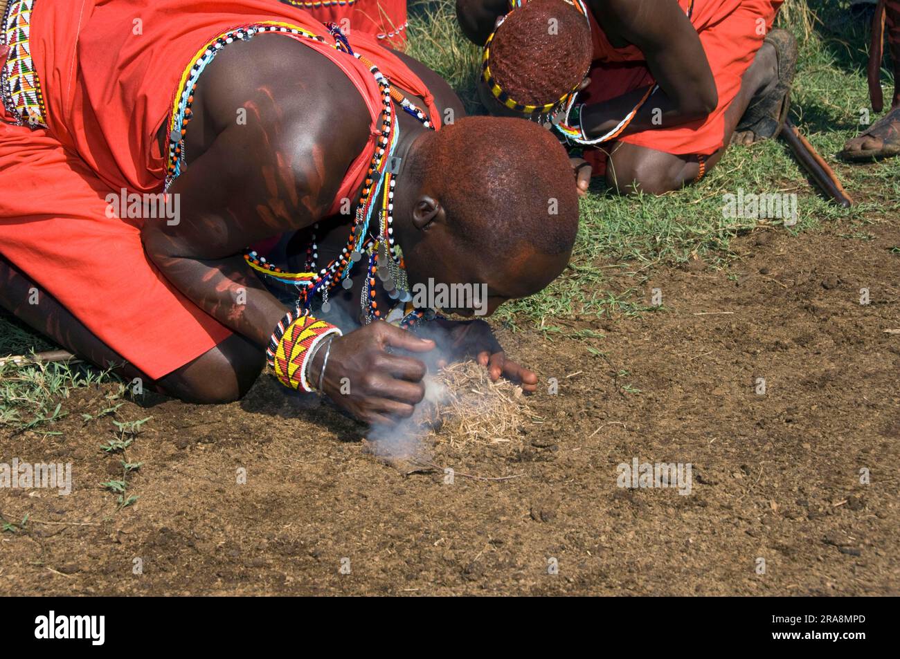Maasai man making fire, Maasai Mara, Kenya Stock Photo - Alamy