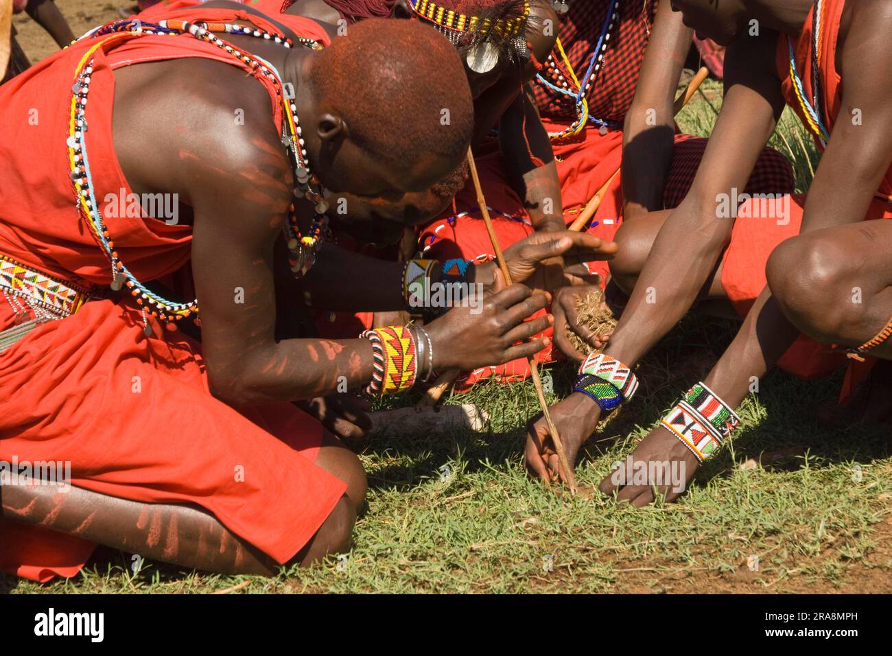 Masai men making fire, Masai Mara, Kenya Stock Photo - Alamy