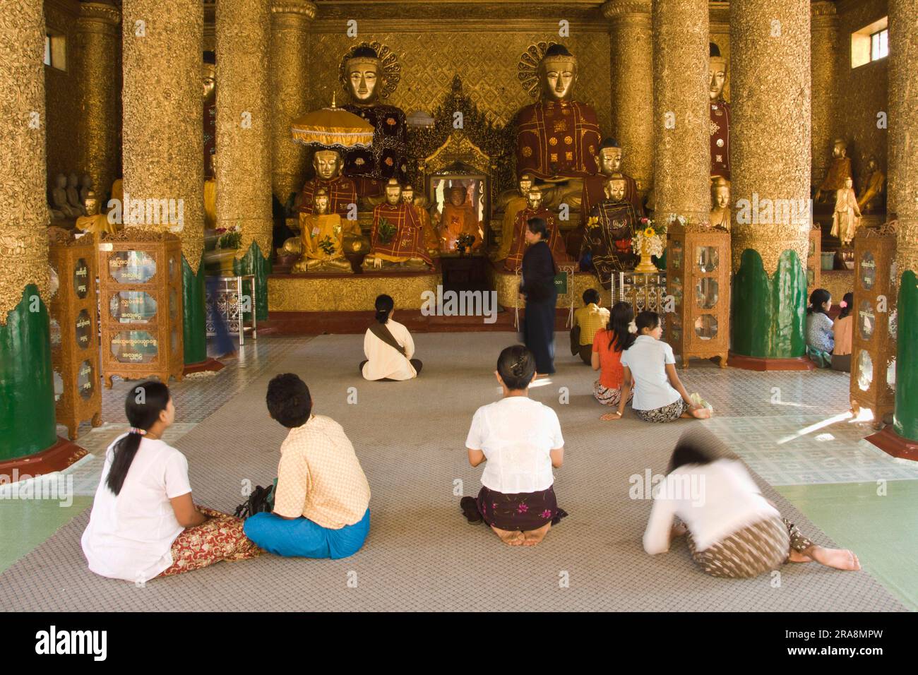 Praying worshippers, Buddha Kassapa Temple, Shwedagon Pagoda, Yangon ...