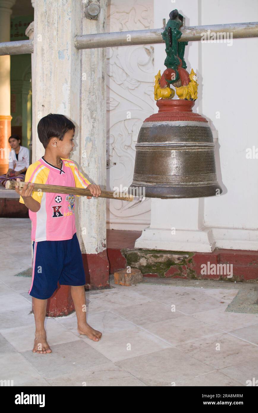 Boy strikes bell, Shwedagon Pagoda, Yangon, Burma, Myanmar, Yangon ...