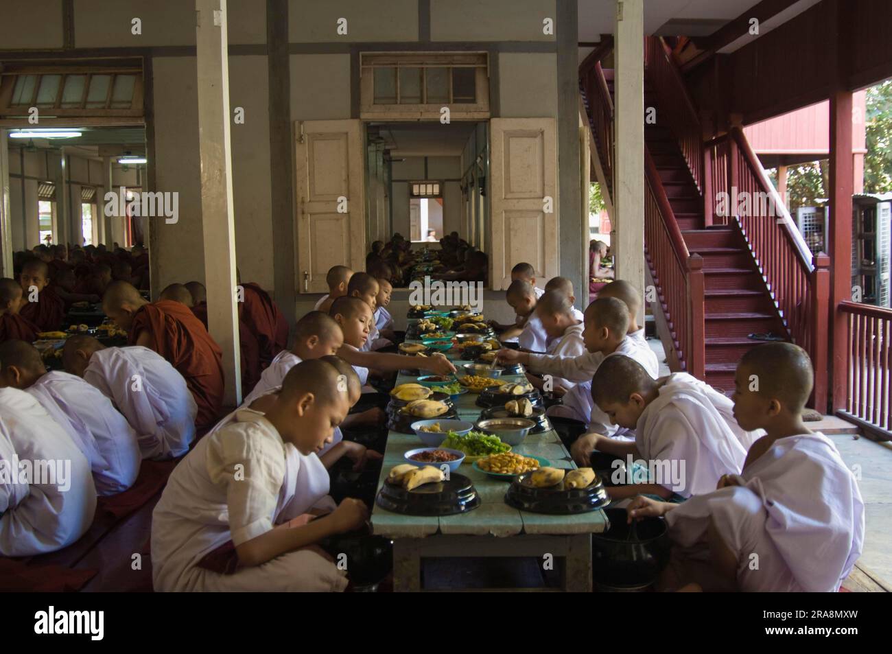 Buddhist monks eating in the refectory, Mahagandayon Monastery ...