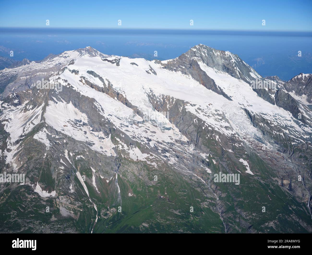 AERIAL VIEW. East-facing sides of Dôme de la Sache (left, 3588m) and ...
