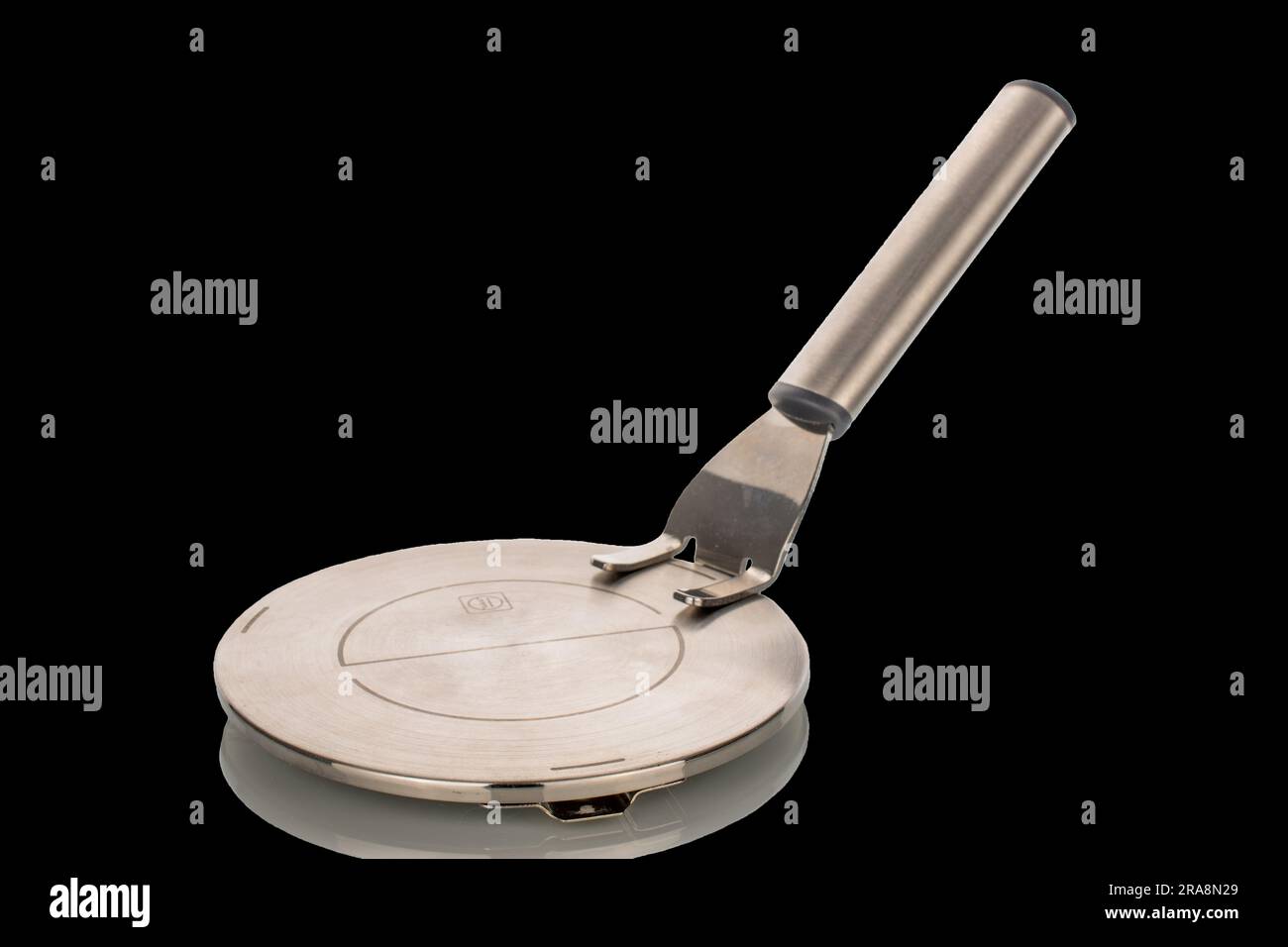 One metal adapter with handle for induction surface, macro, isolated on ...