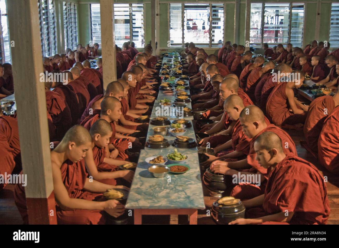 Buddhist monks eating in the refectory, Mahagandayon Monastery ...