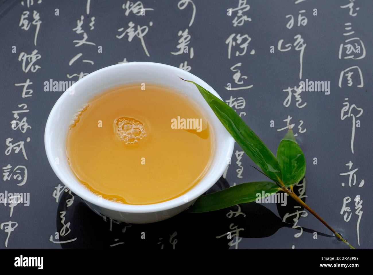 Cup green tea, bamboo leaf and japanese characters, green tea, green ...