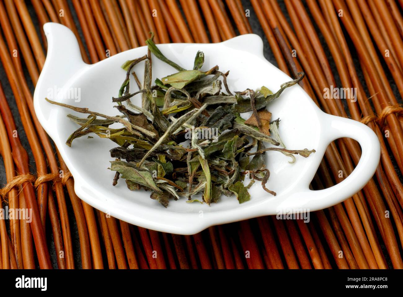 White tea, leaves in bowl, Pai Mu Tan Stock Photo - Alamy