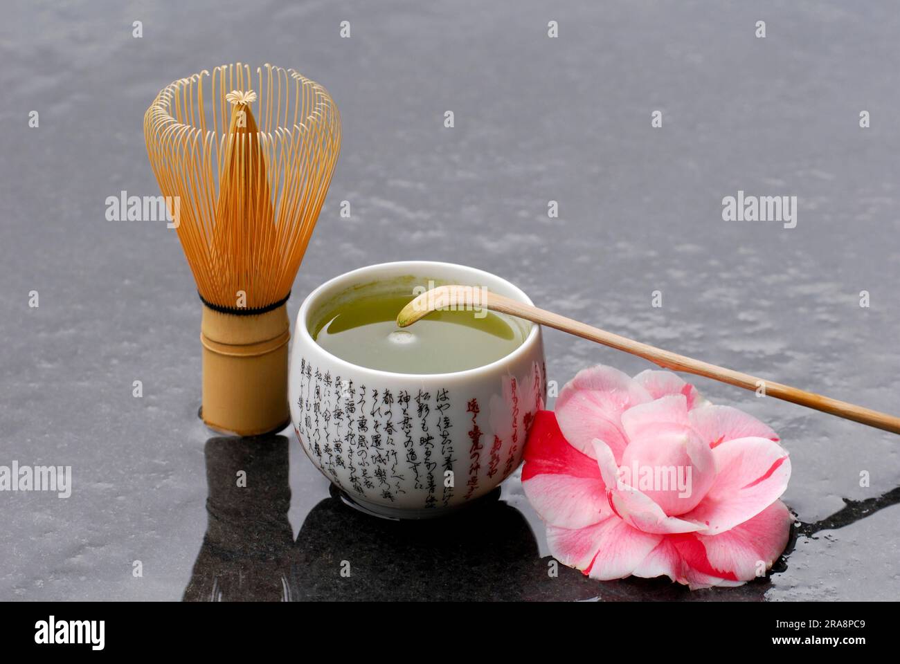 Japanese Matcha tea, 'Chasen' bamboo broom, bamboo spoon and camellia ...
