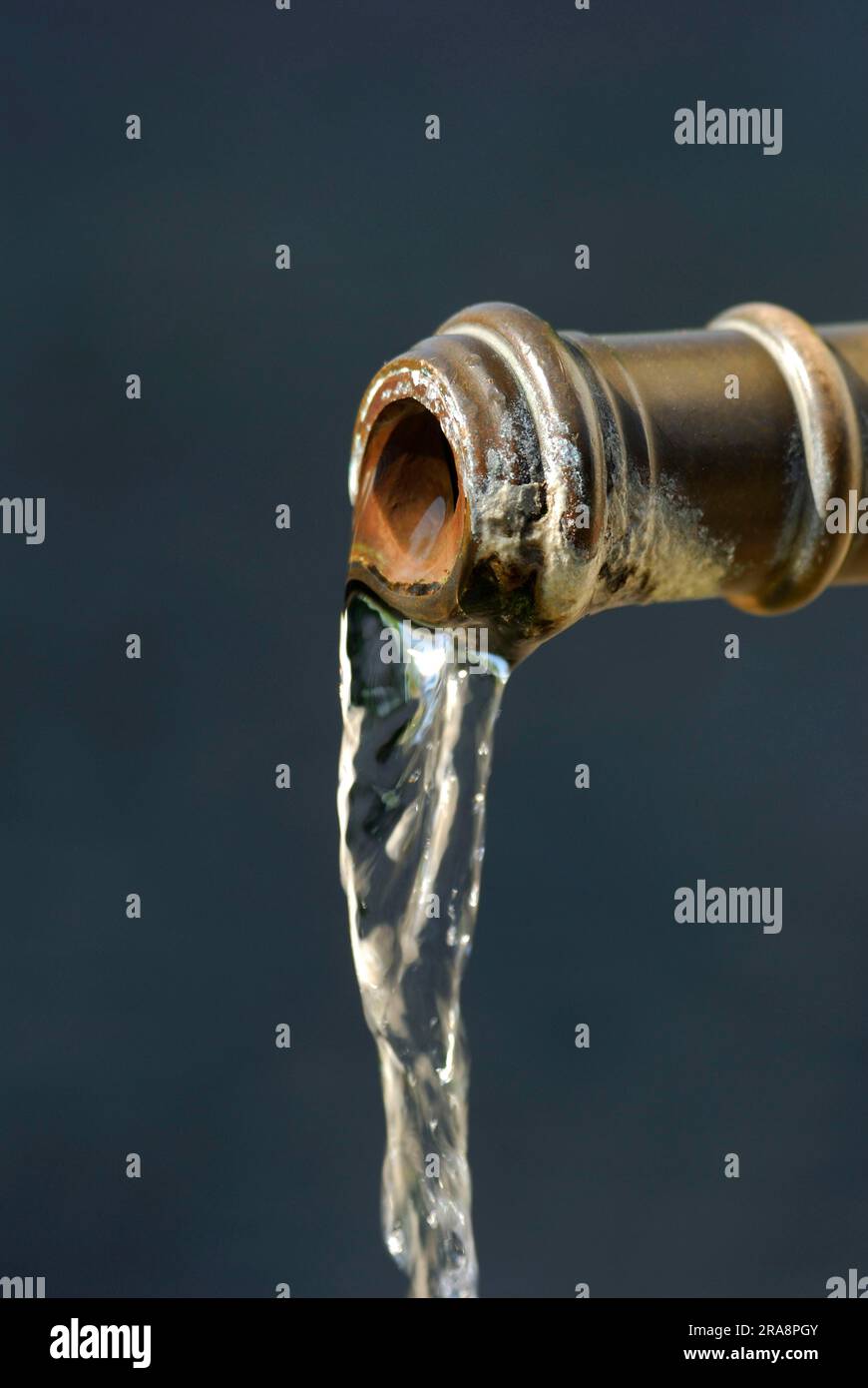 Water flows from pipe Stock Photo - Alamy