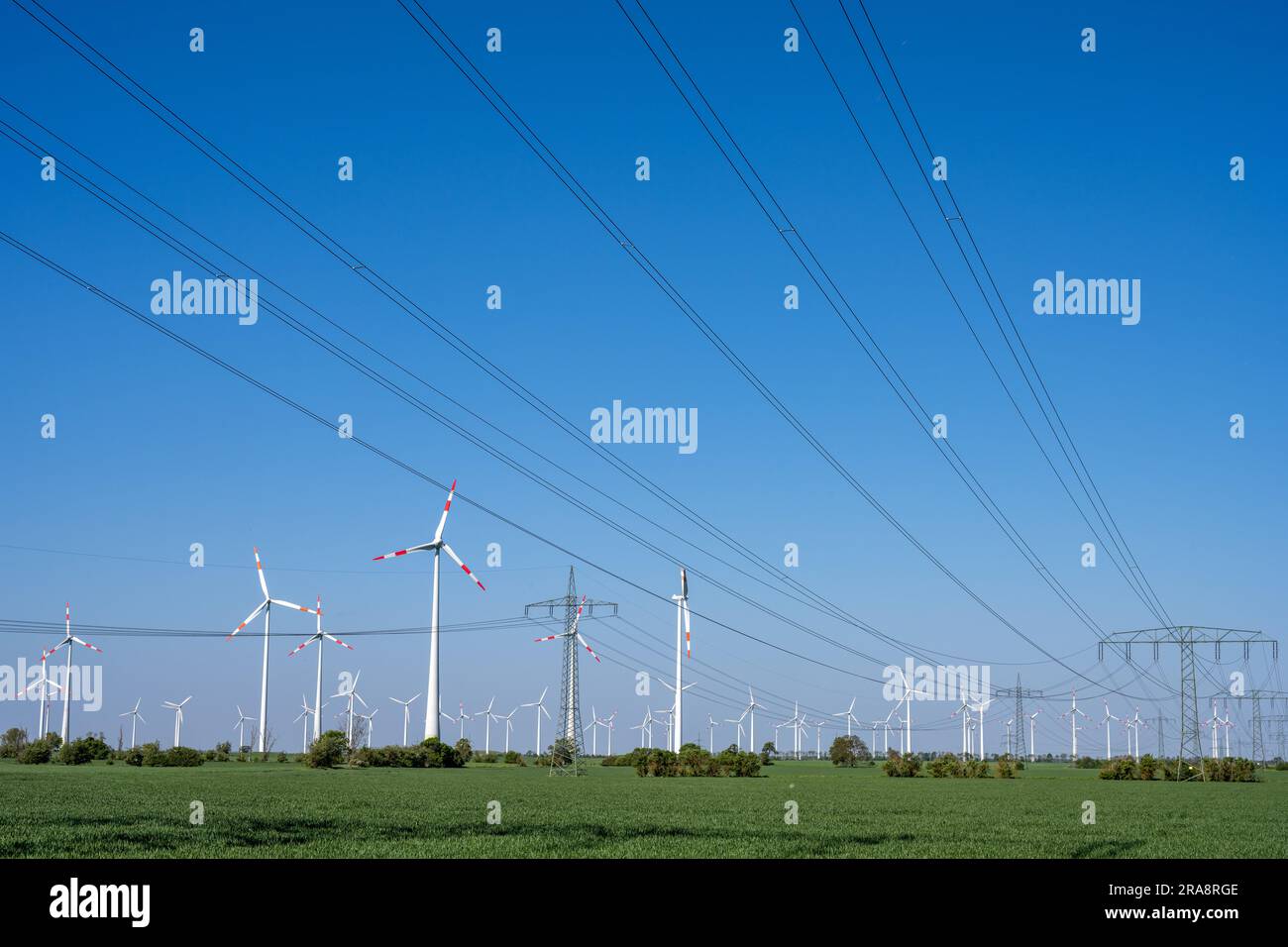 Wind turbines and electric power lines seen in Germany Stock Photo - Alamy