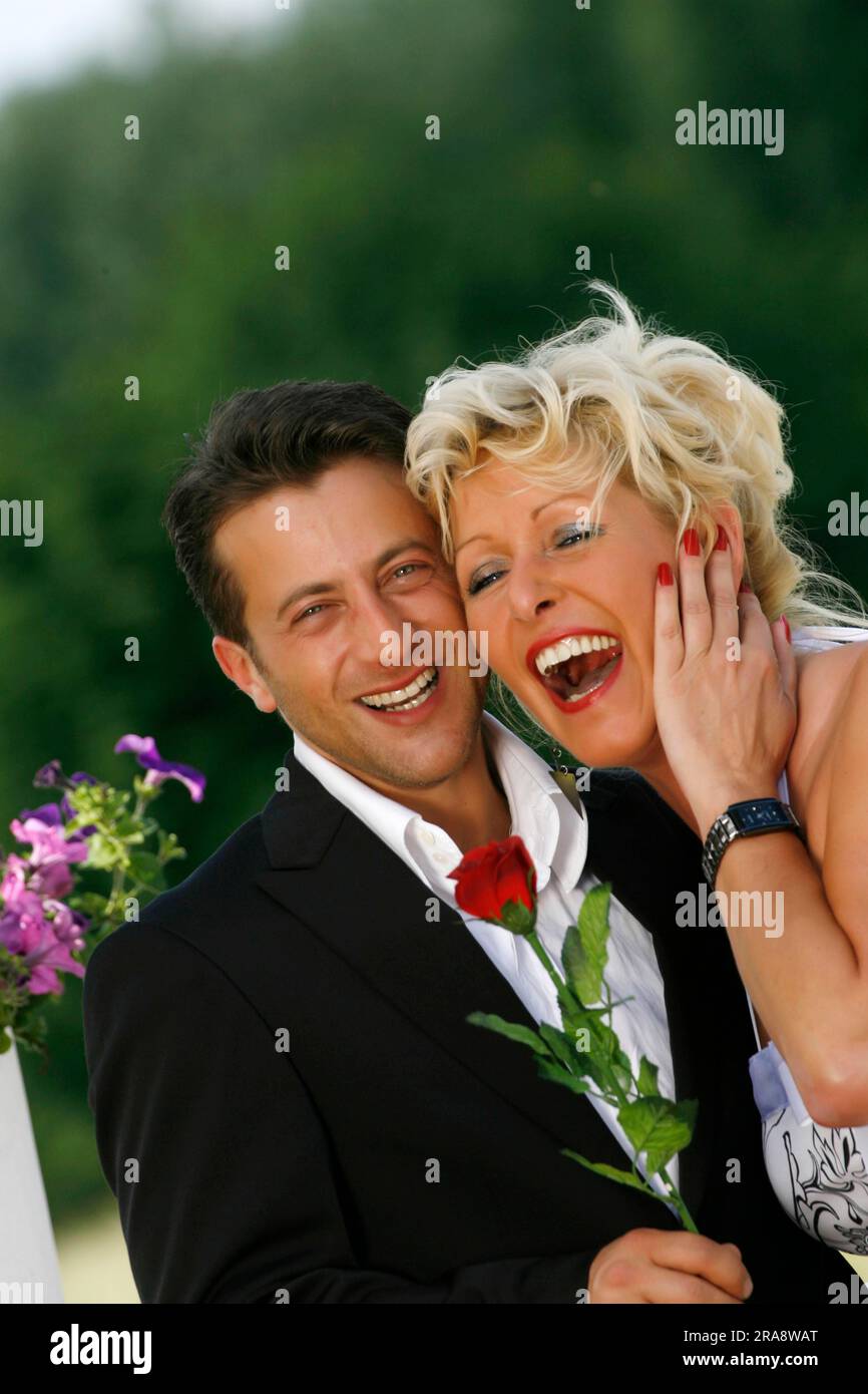 Man gives woman red rose Stock Photo - Alamy Man gives woman red rose Stock Photo - Alamy