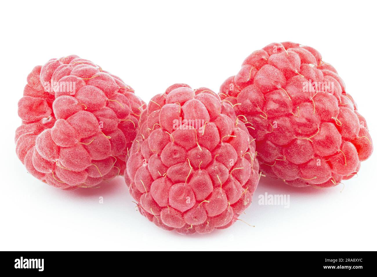 Bunch of raspberry fruits isolated on white background close up. File ...