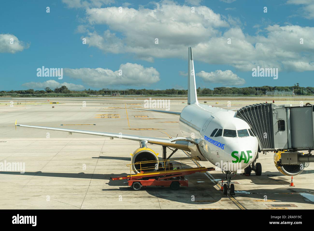 commercial aircraft at airport with SAF text and zero emissions Stock ...