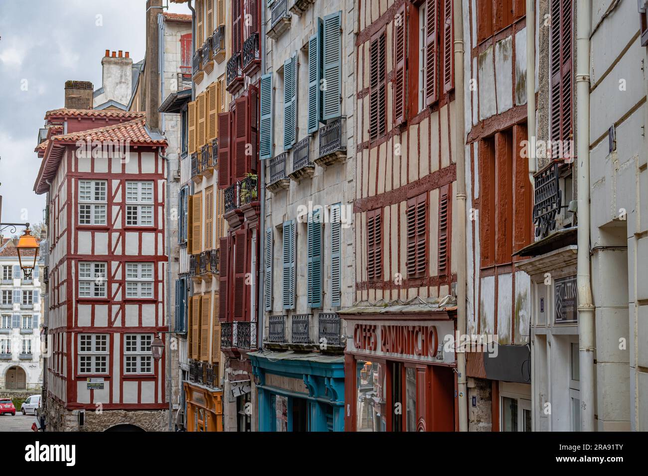 Bayonne, France - 2 April 2023: Street with traditional colorful houses ...