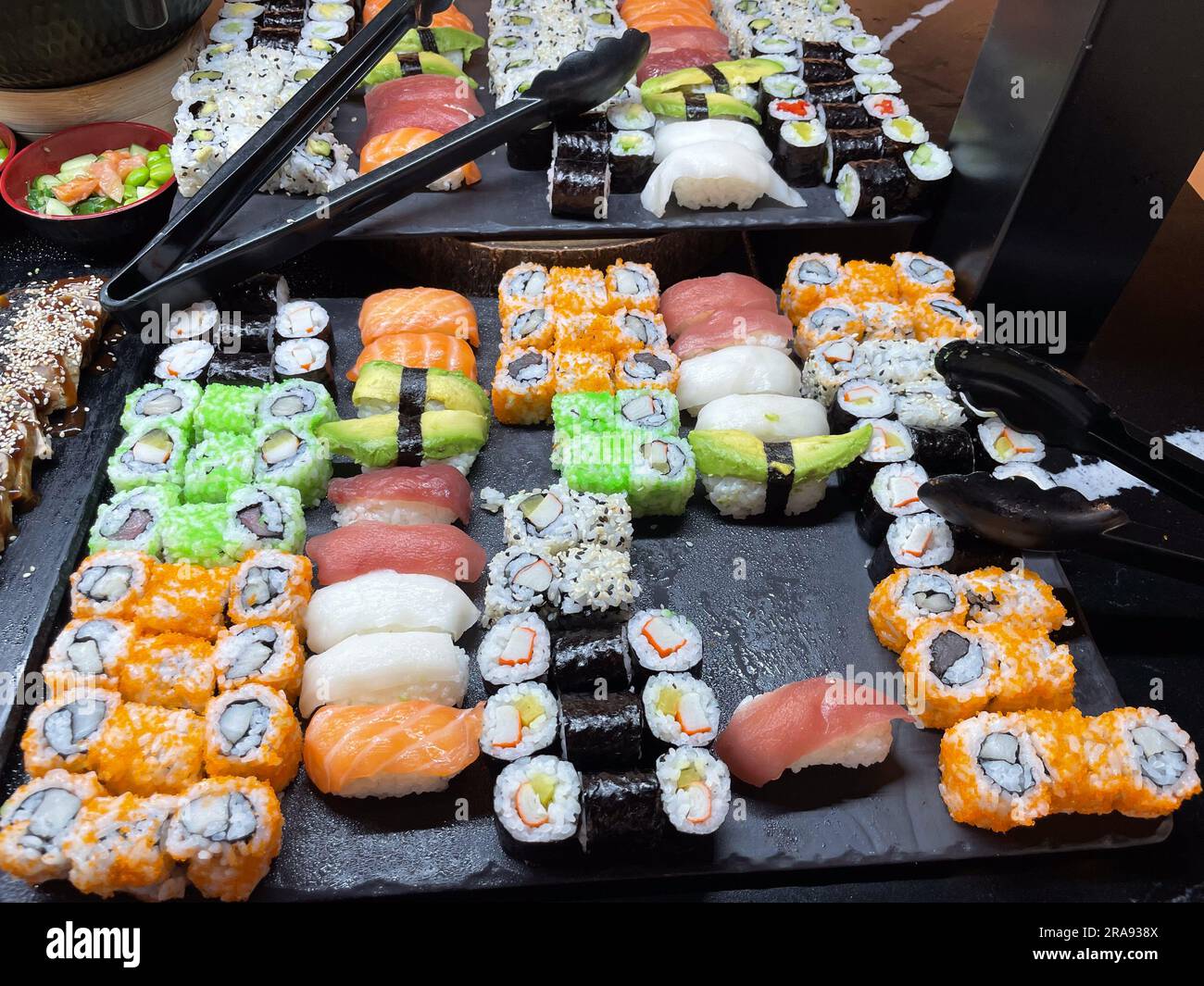 Assorted homemade fresh maki sushi served at a buffet Stock Photo - Alamy