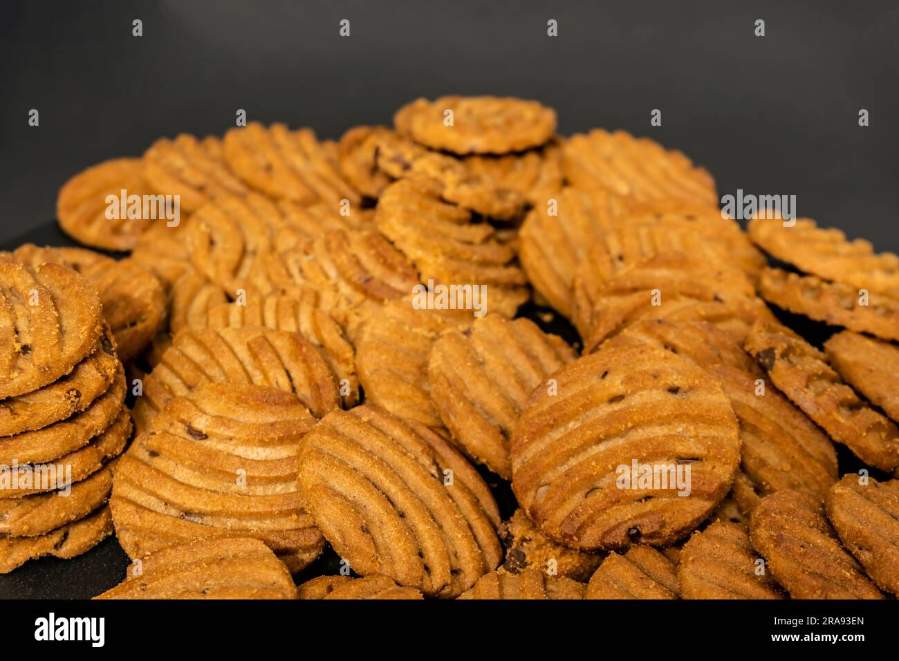 Very Close-Up Of Heap of Delicious Chocolate Chip Cookies on a Black ...