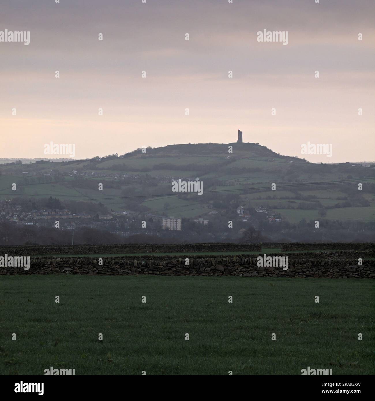 Castle Hill dawn across farmland from Sandy Lane on Crossland Moor ...