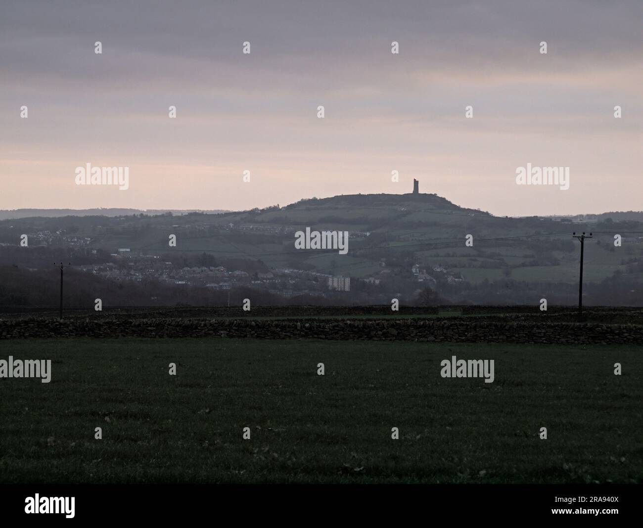 Castle Hill dawn across farmland from Sandy Lane on Crossland Moor ...