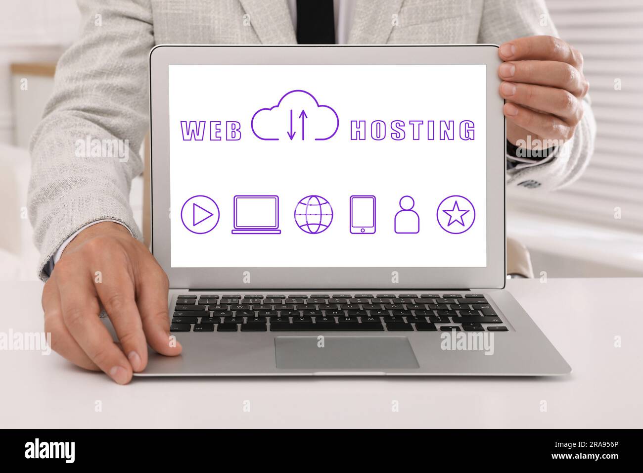 Web hosting. Man showing laptop at table, closeup. Digital cloud with ...