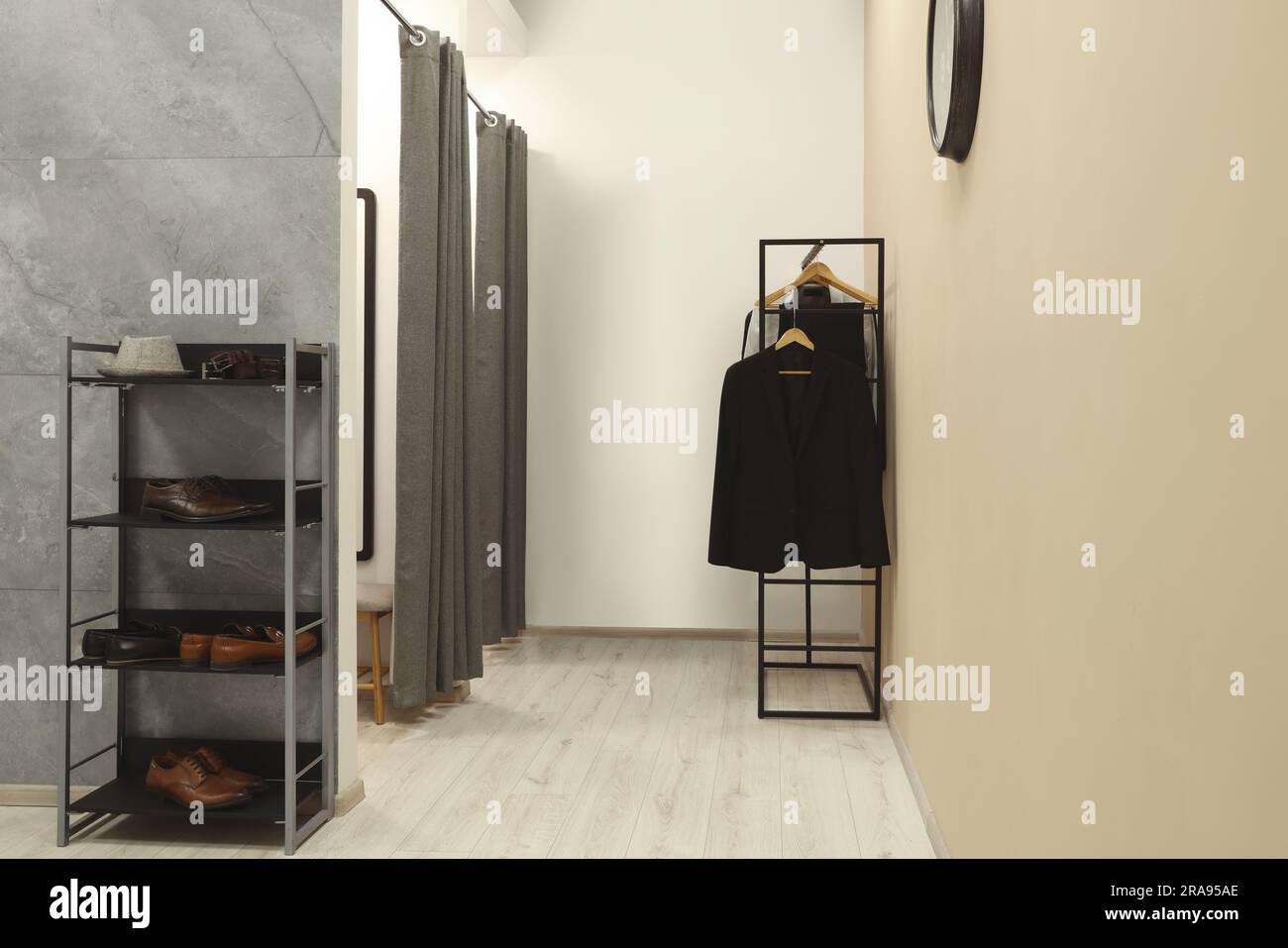 Dressing room with clothing rack in fashion store. Stylish design Stock ...