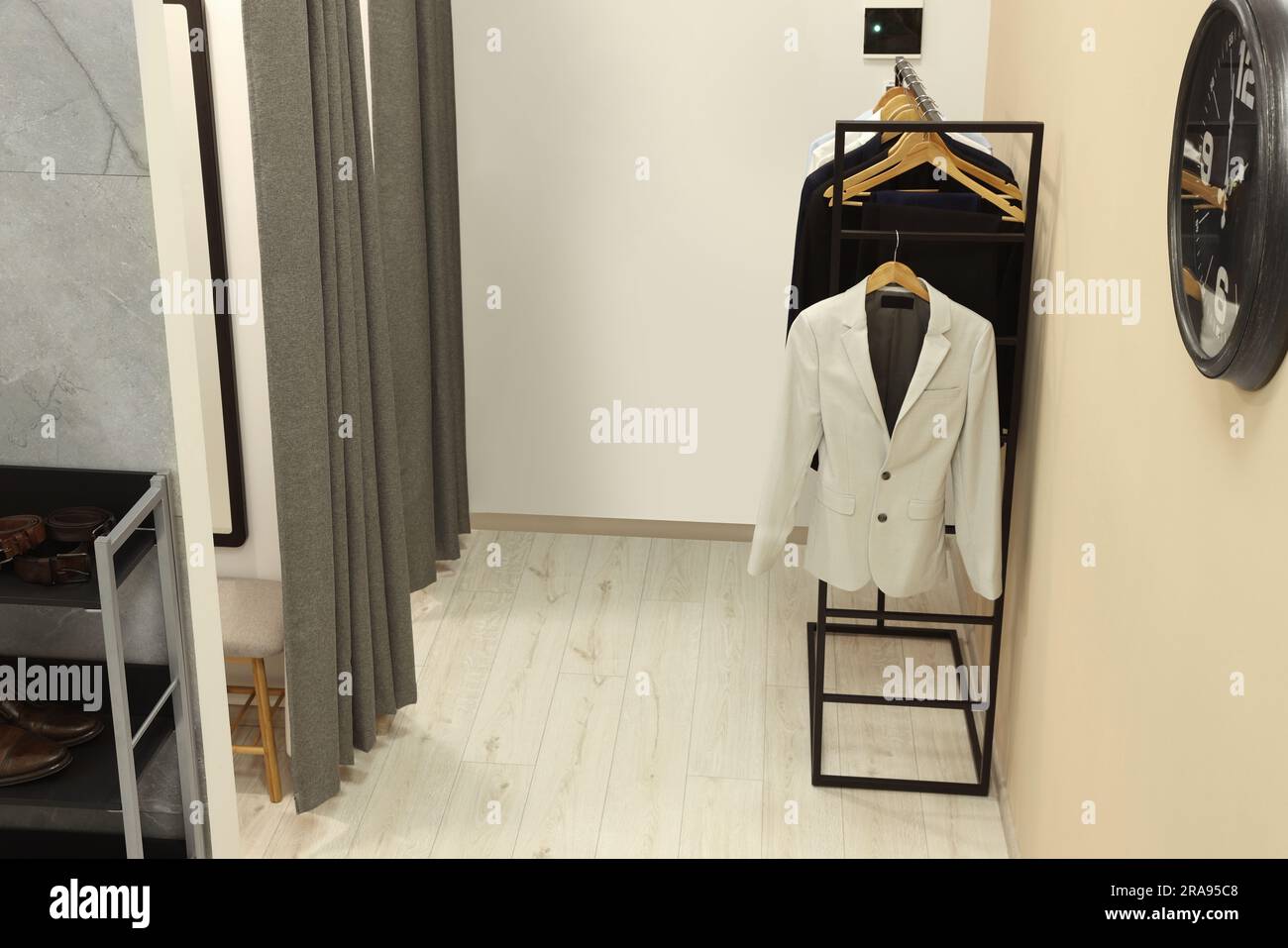 Dressing room with clothing rack in fashion store. Stylish design Stock ...