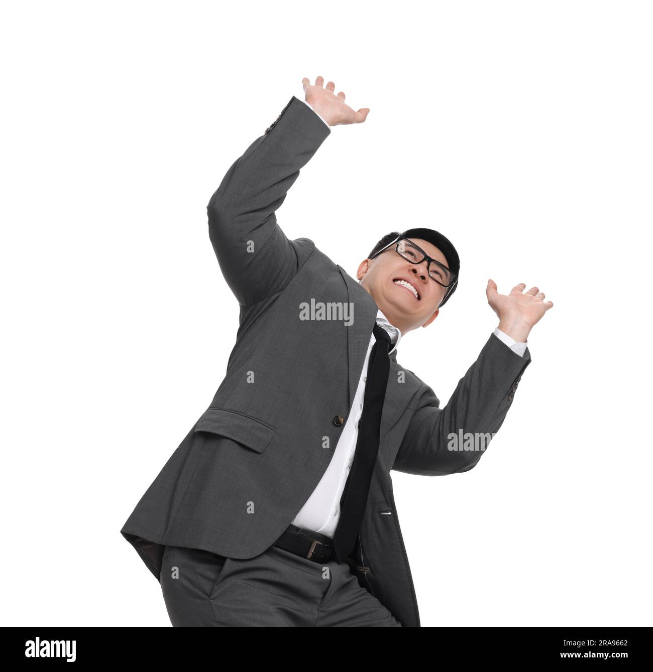 Scared businessman in suit posing on white background Stock Photo - Alamy