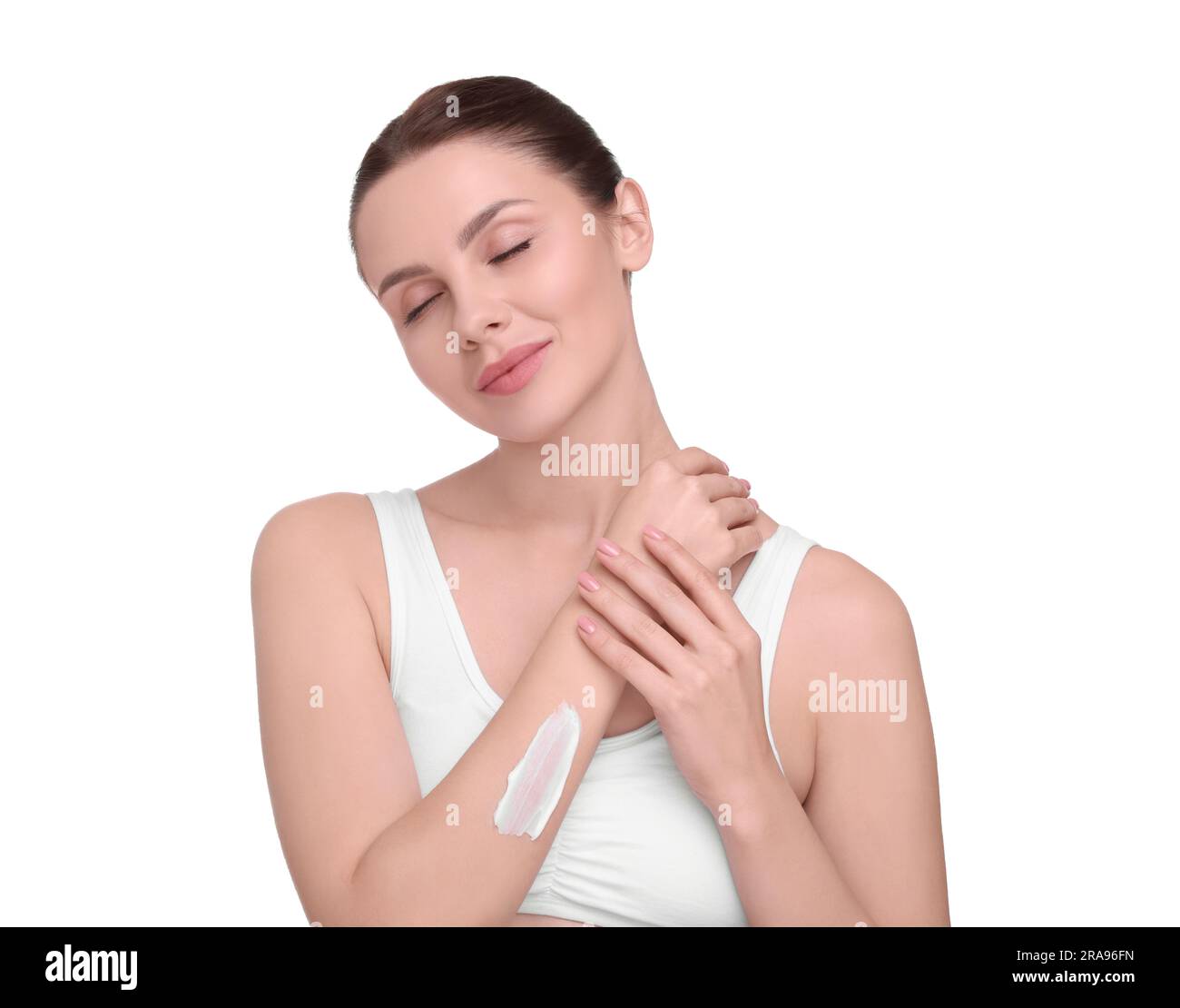 Beautiful woman with smear of body cream on her arm against white ...