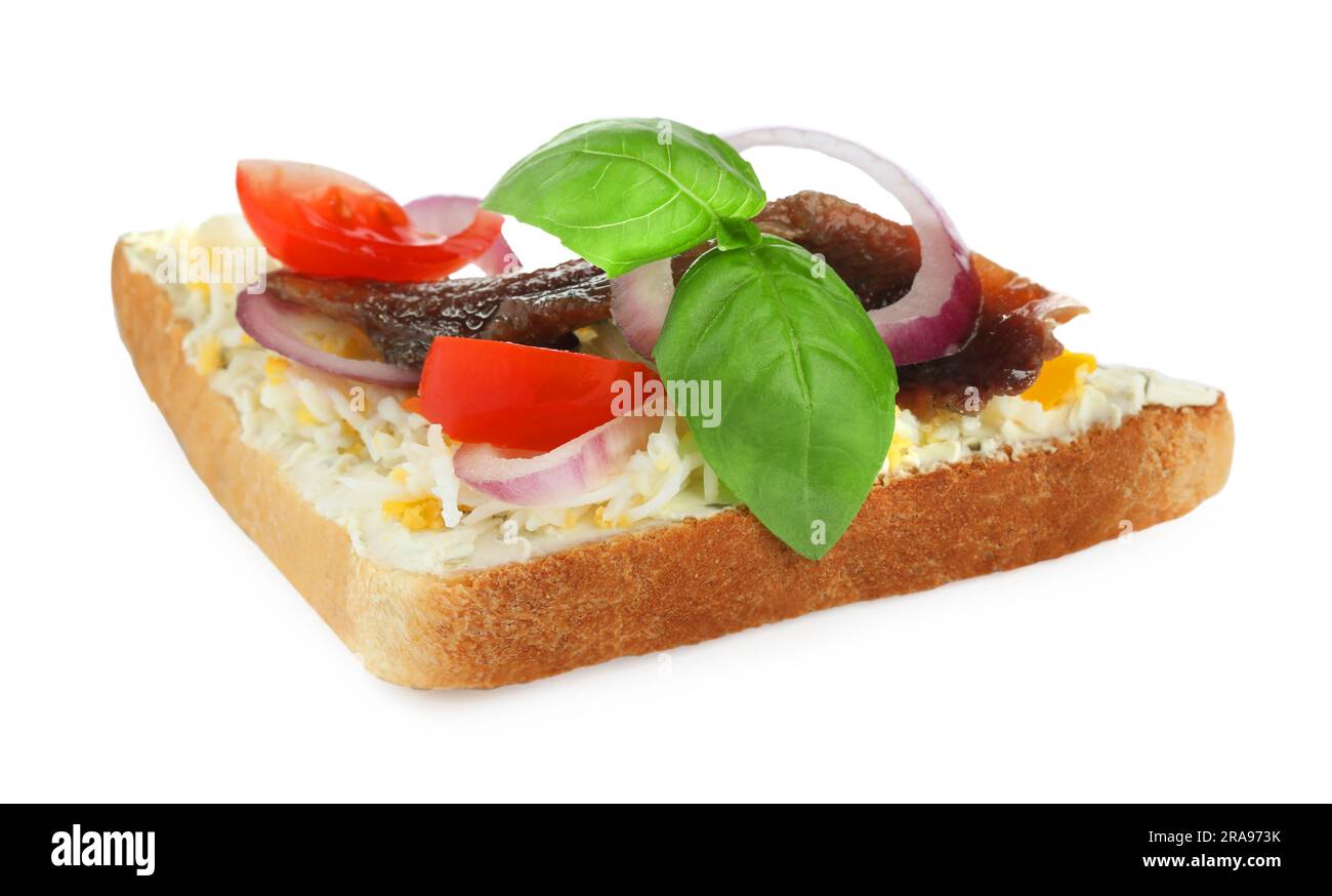 Delicious sandwich with anchovy, tomato and basil on white background ...