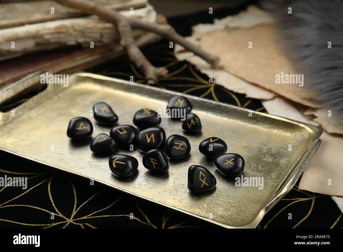 Tray with many black rune stones on divination mat, closeup Stock Photo ...