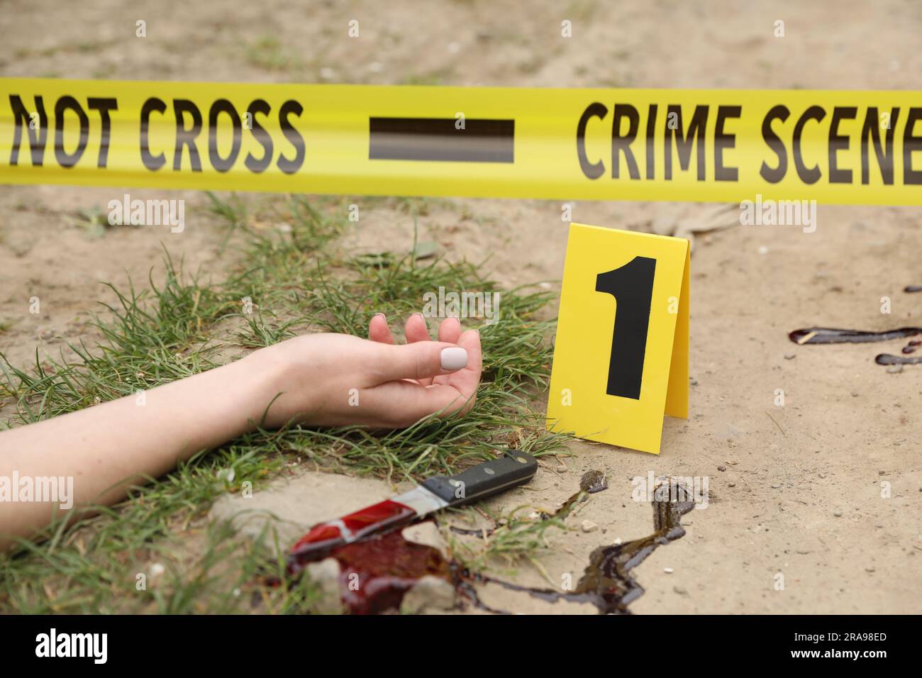 Crime scene tape hand hi-res stock photography and images - Alamy