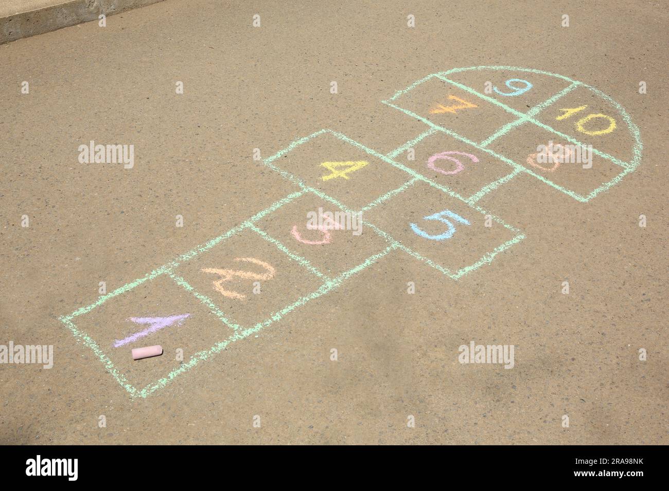 Hopscotch drawn with colorful chalk on asphalt outdoors Stock Photo - Alamy