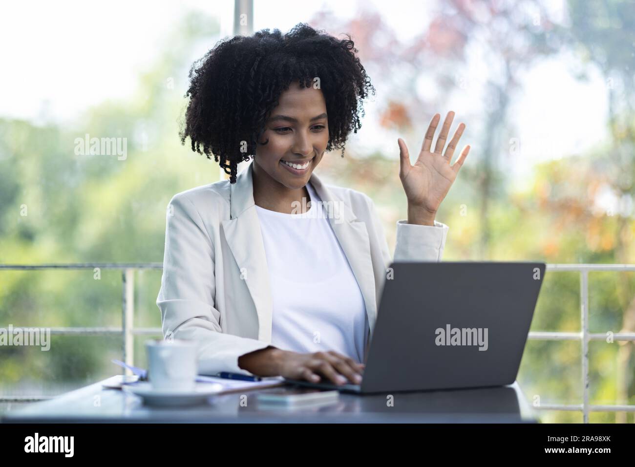 Cheerful millennial black woman have video call, cafe interior Stock ...