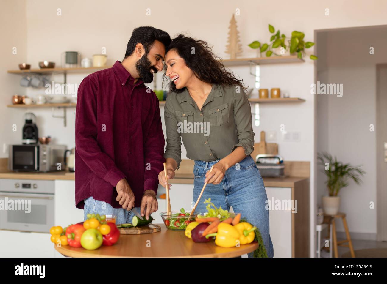 Romantic arab spouses bonding, preparing meal together, loving husband ...