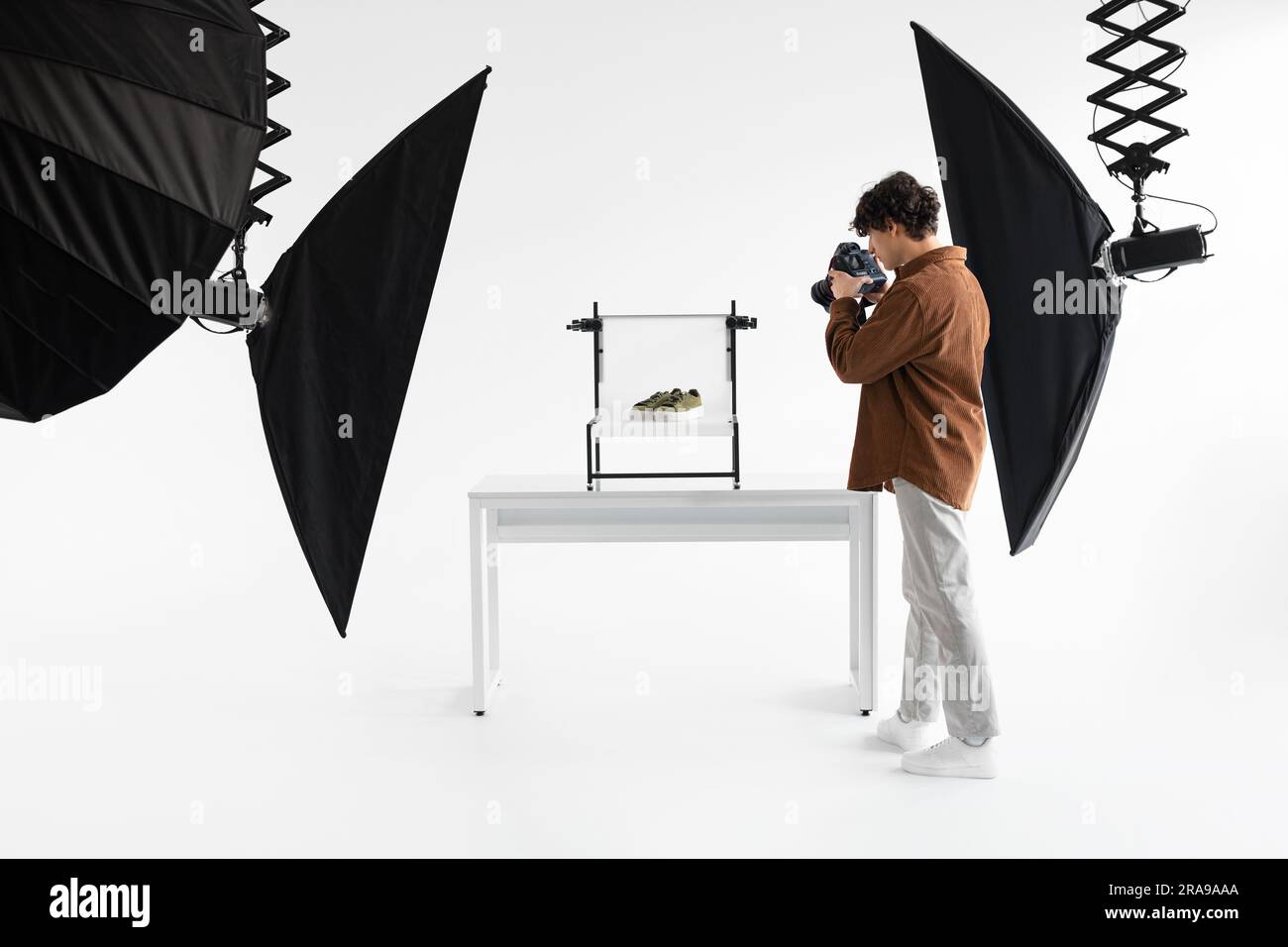 Content creator. Professional photographer man working with modern ...