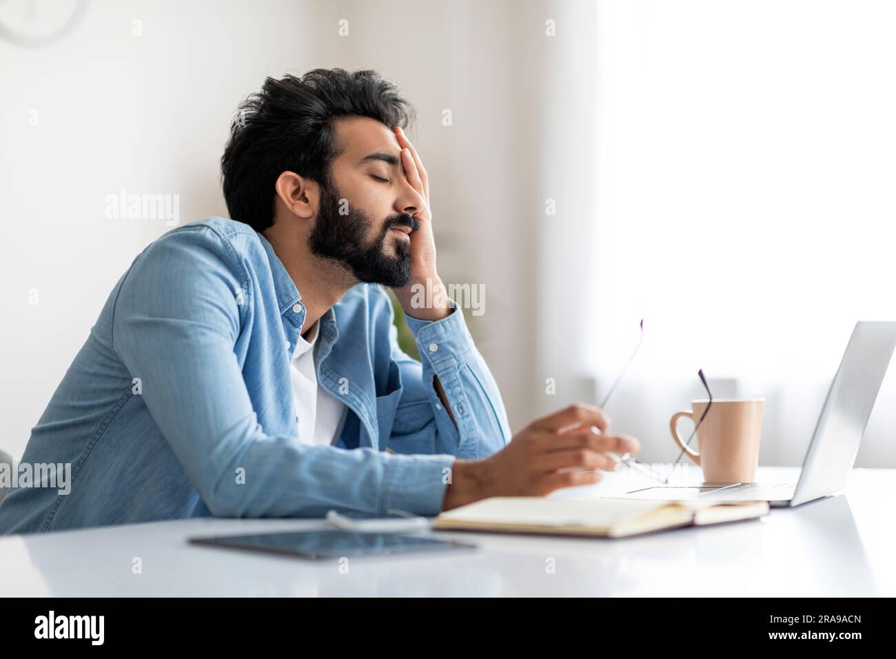 Indian businessman sleeping in office hi-res stock photography and ...