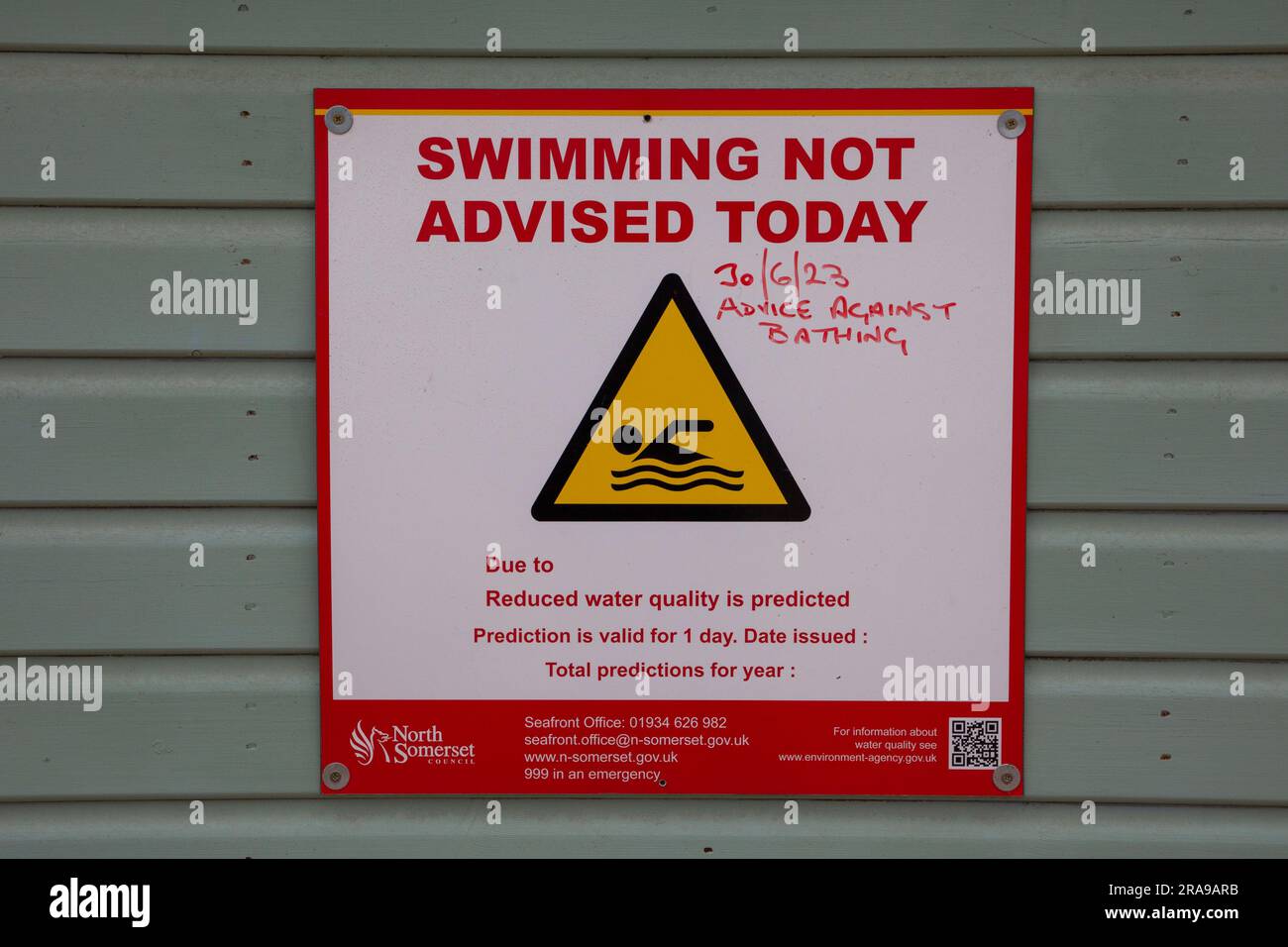A sign warning against swimming in the Bristol Channel due to reduced ...