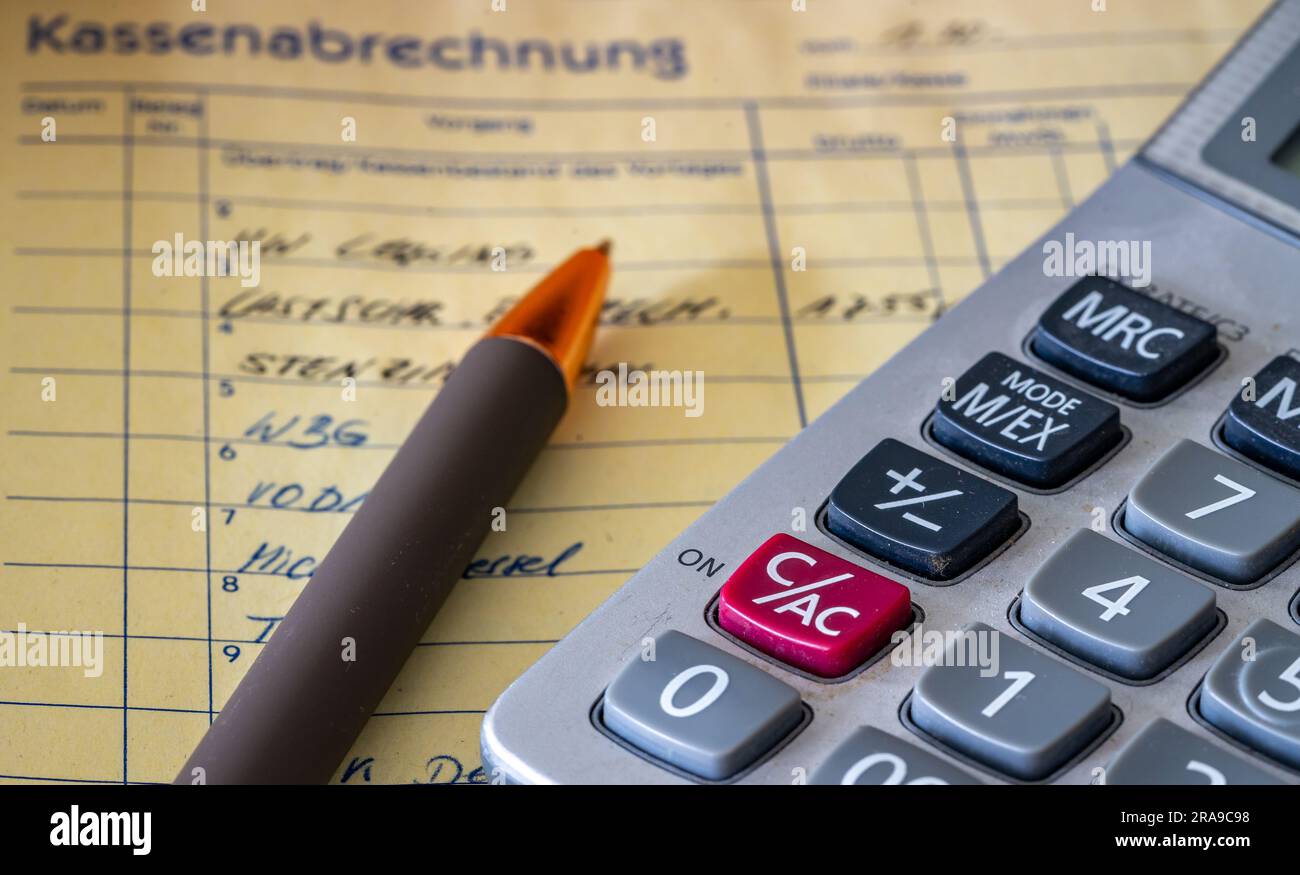 cash accounting book with calculator and pen 01 Stock Photo - Alamy