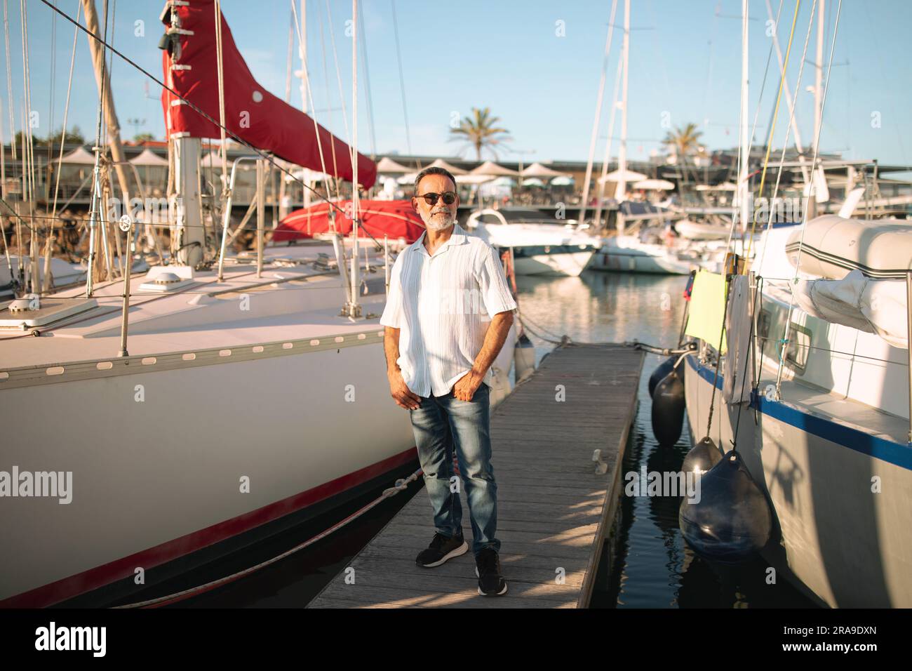 Tanned Mature Man On Vacation Posing Near Luxury Sailboat Outdoor Stock ...