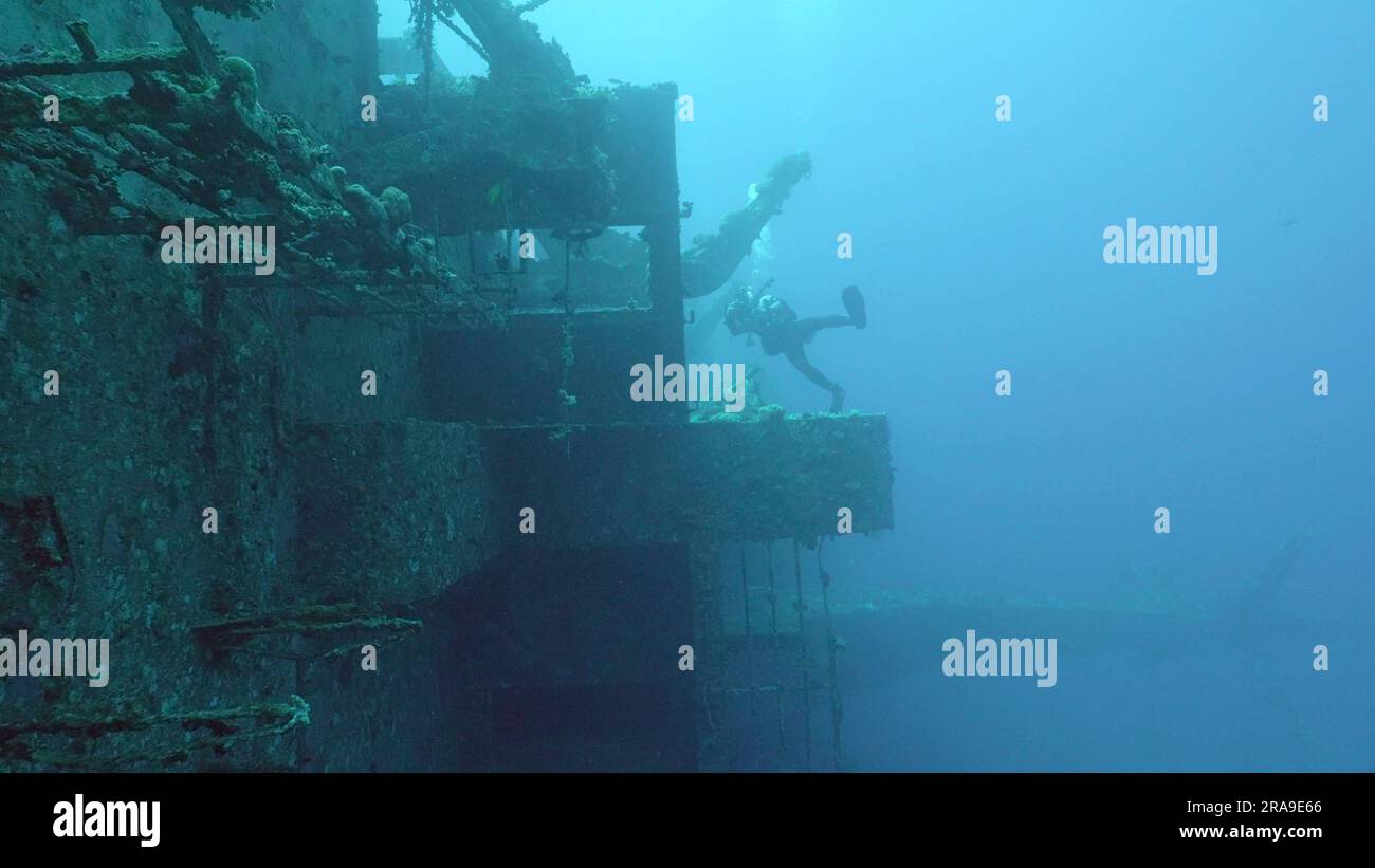Scuba diver swim along deck of ferry Salem Express shipwreck ...