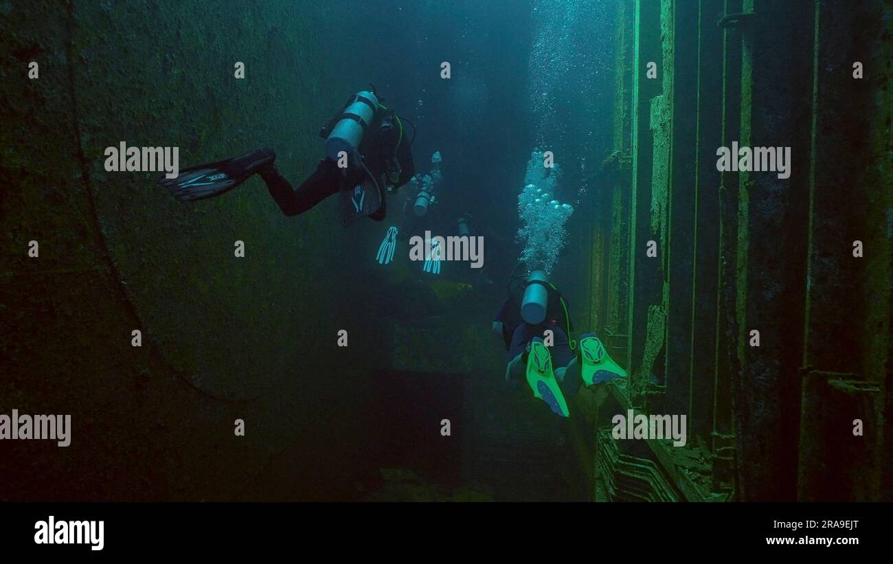 Scuba diver swim inside of ferry Salem Express shipwreck, Red sea ...