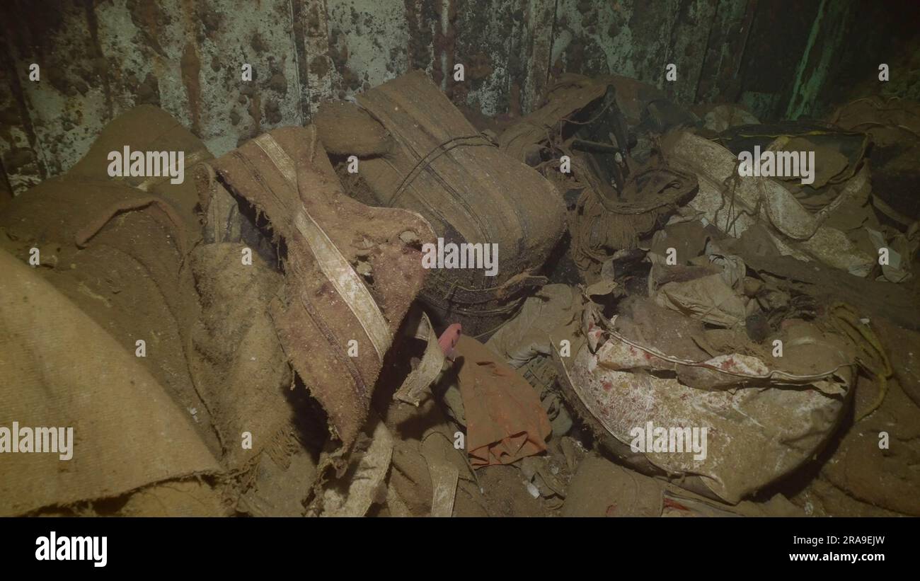 Passengers luggage and personal belongings lie inside hold of ferry ...