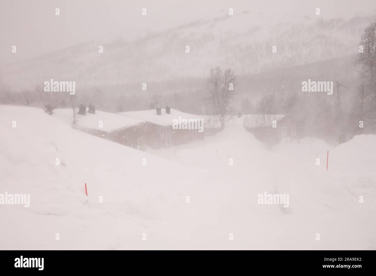 HEMAVAN, SWEDEN ON MARCH 17, 2023. Mountain lodges in a blizzard ...