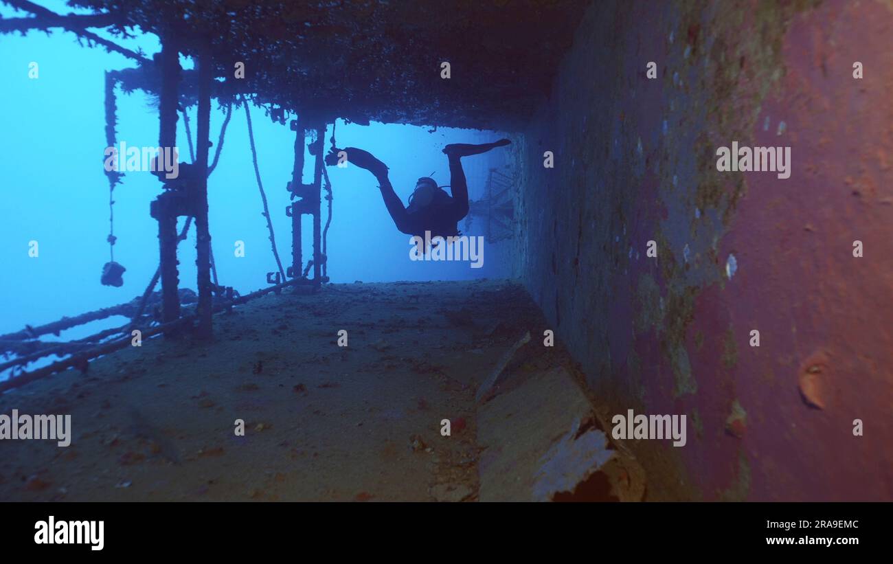 Scuba diver swim down corridor of ferry Salem Express shipwreck, Red ...