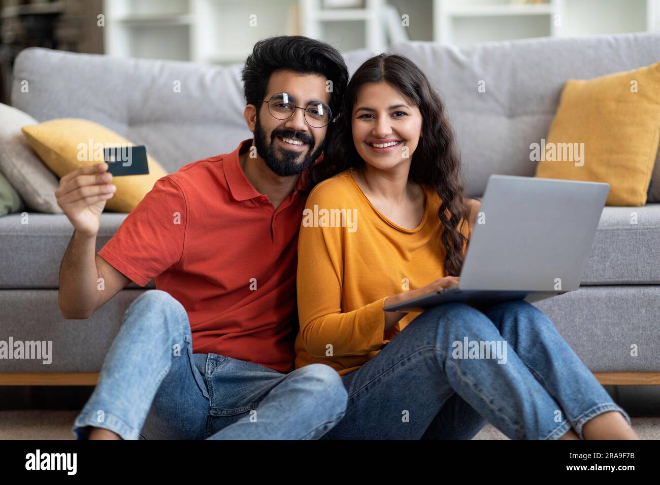 Online Banking. Portrait Of Happy Indian Family With Laptop And Credit ...