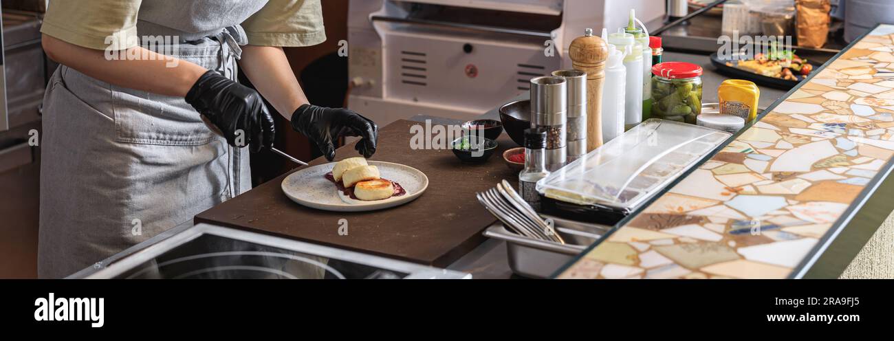 Female chef decorate cheesecake before serving for breakfast in ...