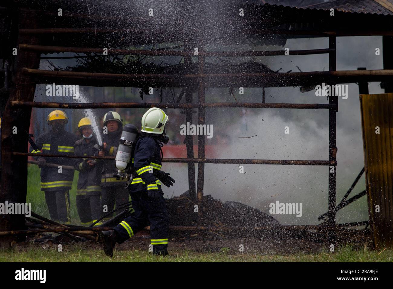 Kathmandu, Nepal. 2nd July, 2023. Firefighters try to put out the fire ...