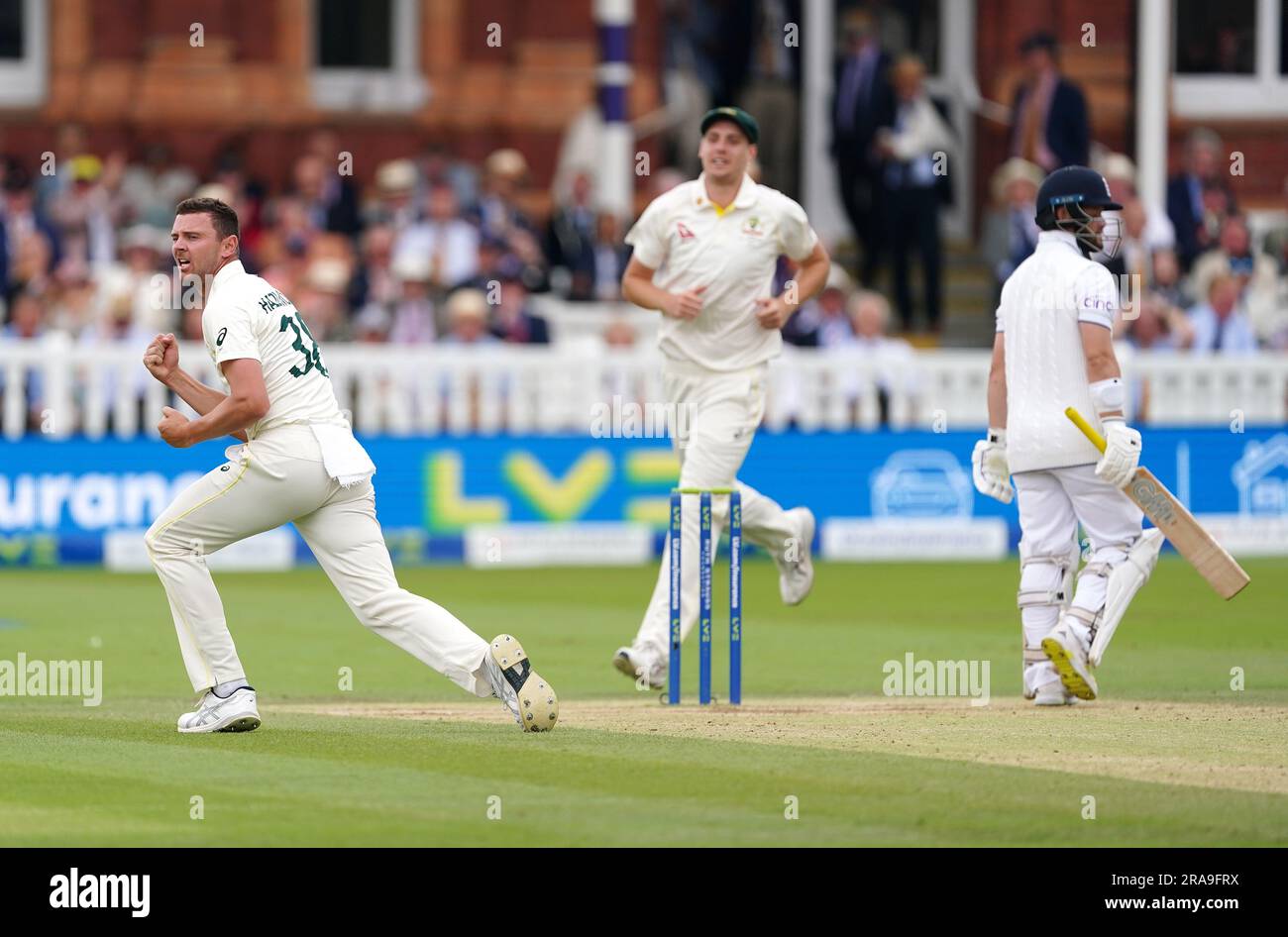 Australia's Josh Hazlewood (left) celebrates the wicket of England's ...