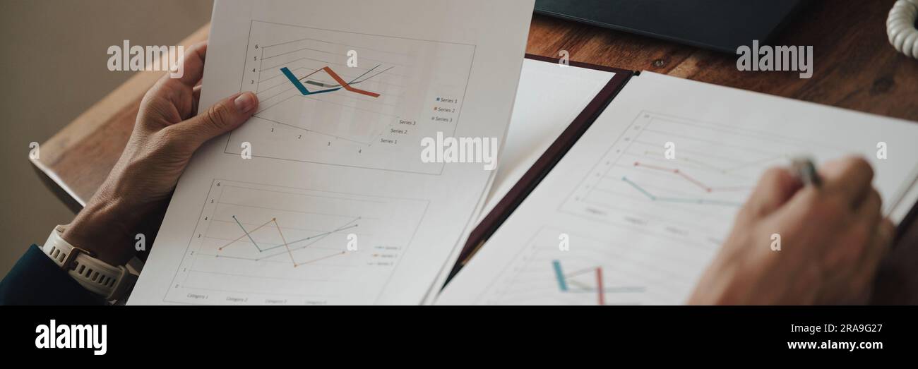 Reviewing documents stock market data hi-res stock photography and ...
