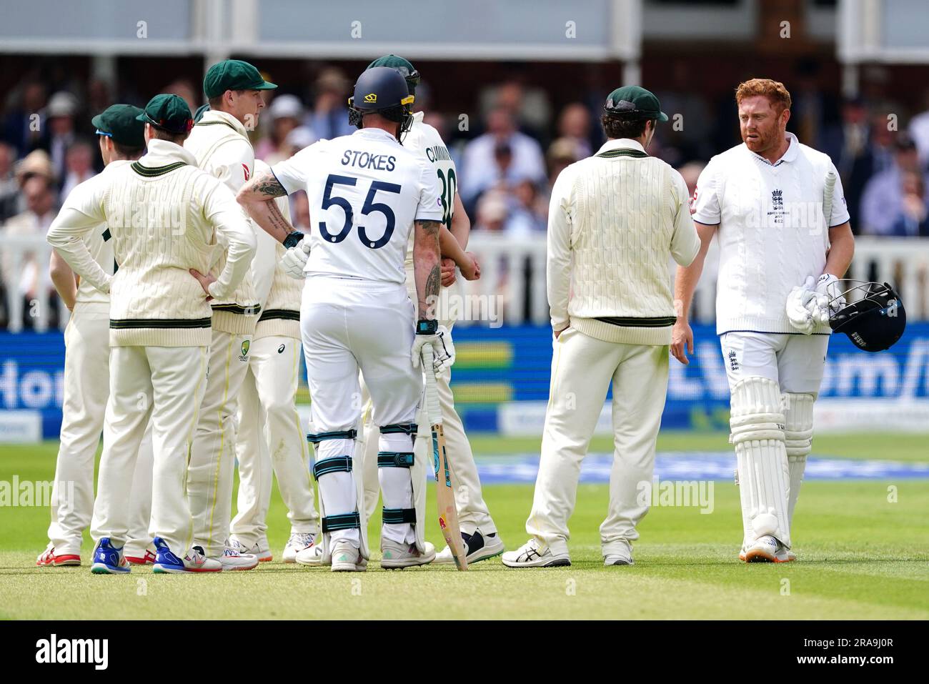Australia's Travis Head and England's Jonny Bairstow (right) react to ...